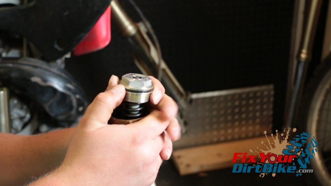11 remove fork cap assembly | Fix Your Dirt Bike